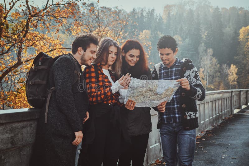 Young People are Looking for Right Path Using Map Stock Photo - Image ...