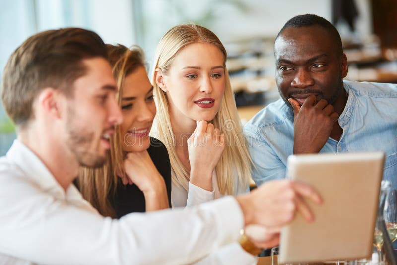 Young People are Looking at a Tablet Computer Stock Image - Image of ...