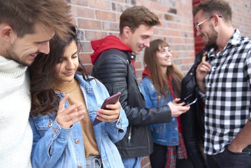 Young People with Mobile Phone Spending Time Together Stock Image ...