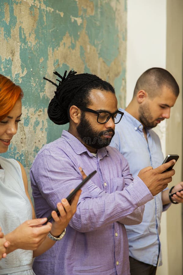 Young People with Mobile Phones in Hands Stock Image - Image of ...