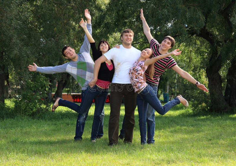 Group of People in Huddle in Field Stock Photo - Image of blond, male ...