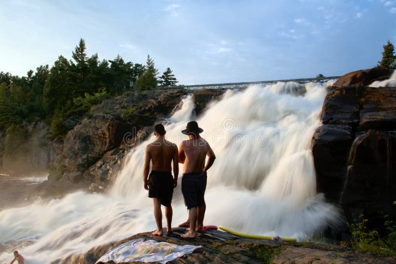 Young People Near Waterfall Stock Photo - Image of rocks, nature: 83079410