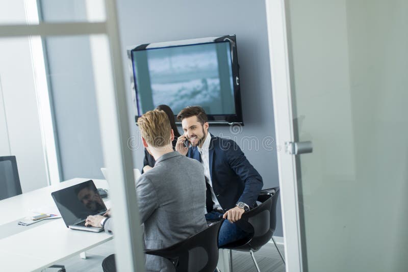 Young people in the office stock image. Image of adult - 55212397