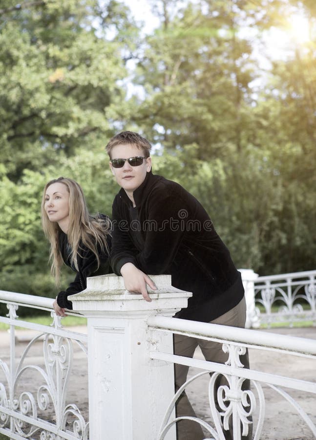 Young People in the Park on the Bridge Stock Photo - Image of summer ...