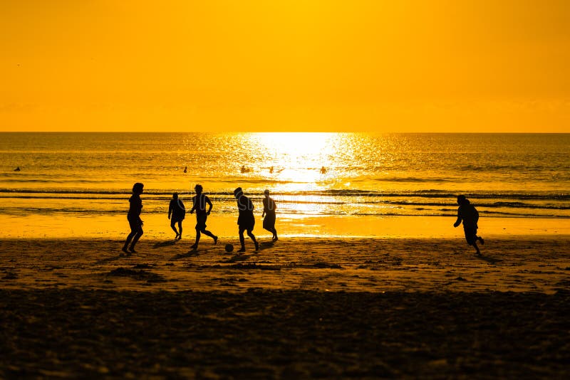 Young People Playing Football on a Beach at Sunset Editorial Image ...