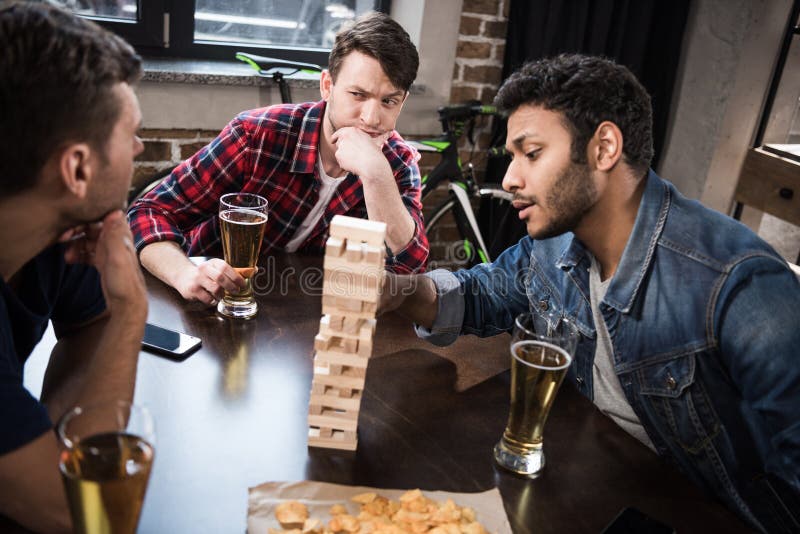 Young People Playing Jenga Game Stock Image - Image of playful, friends ...