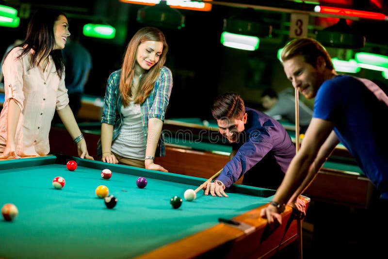 Young people playing pool stock photo. Image of people - 53183908
