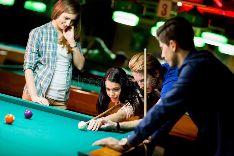 Young people playing pool stock photo. Image of leisure - 53443316