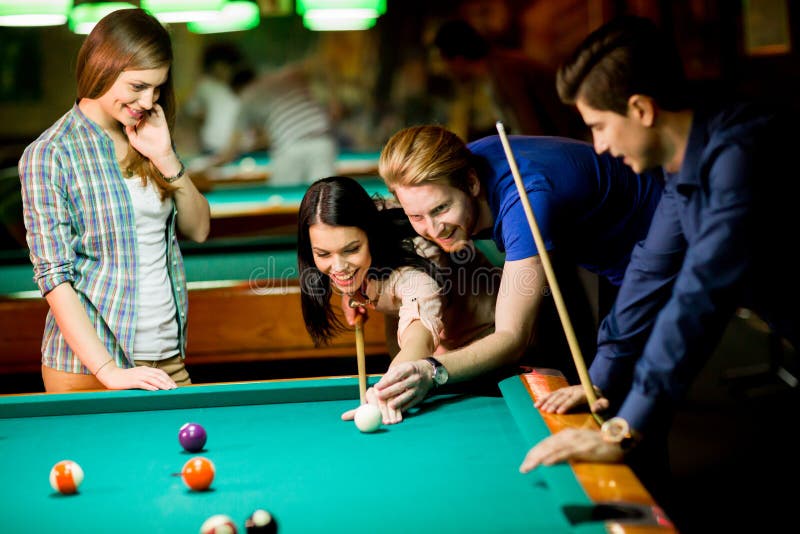 Young people playing pool stock image. Image of beautiful - 53606057
