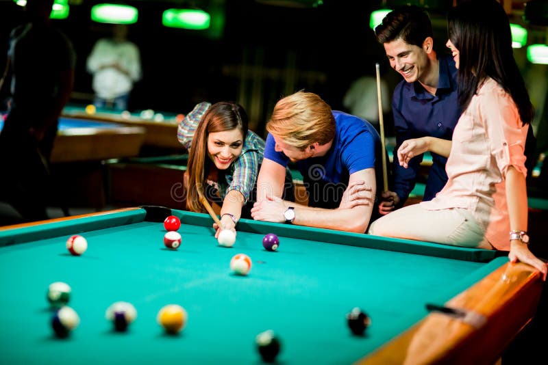 Young people playing pool stock image. Image of queue - 53800269