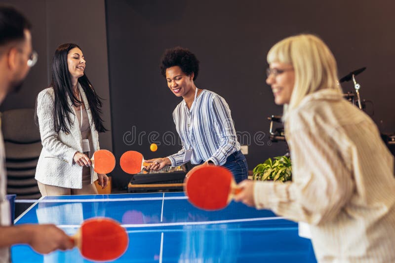 People Playing Table Tennis in the Office at Work Stock Photo - Image ...