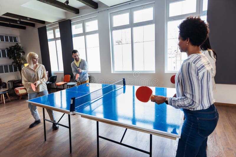 People Playing Table Tennis in the Office at Work Stock Photo - Image ...