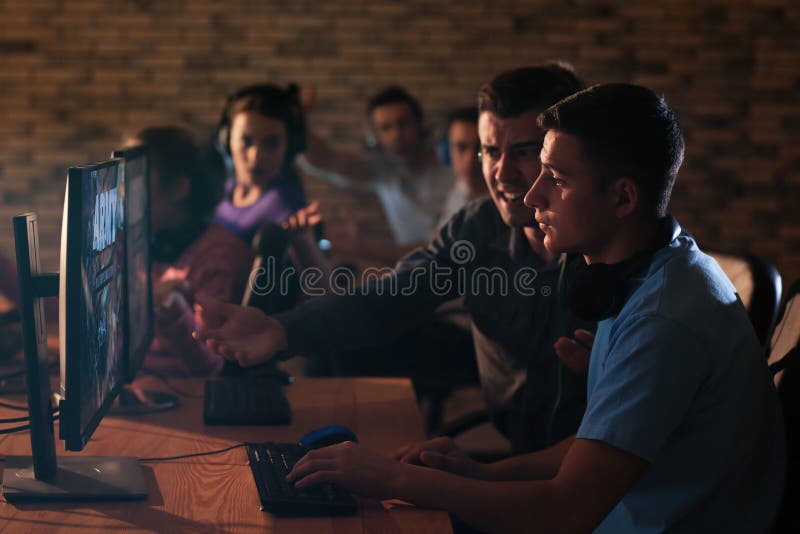 Young People Playing Video Games at Tournament Stock Photo - Image of ...