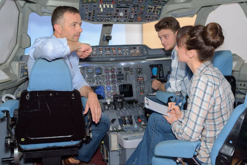 Young People Questioning Man in Cockpit Aircraft Stock Photo - Image of ...