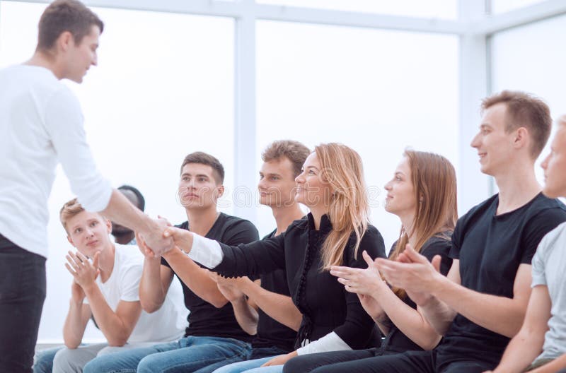 Young People Shaking Hands at a Group Meeting. Stock Photo - Image of ...