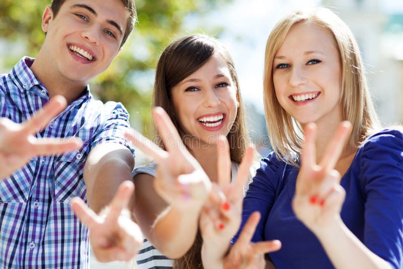 Young People Showing Peace Sign Stock Photo - Image of friendship ...