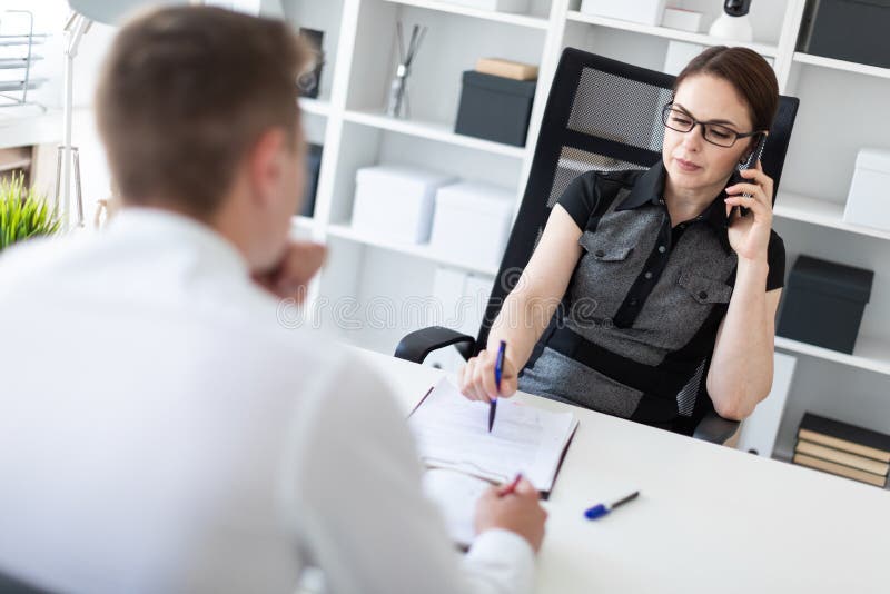 Young People Sit in the Office at the Computer Table and Work with ...