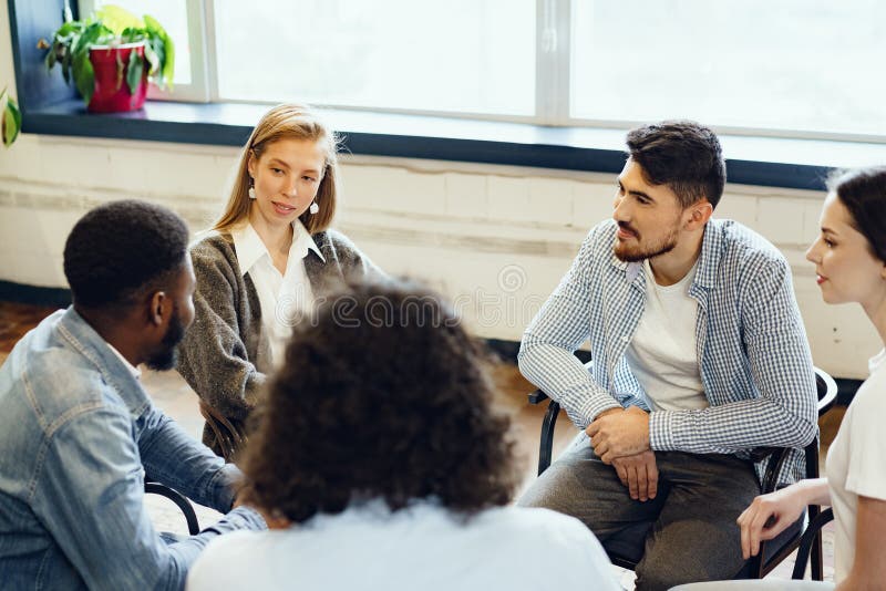 Young People Sitting in a Circle and Having a Discussion Stock Photo ...
