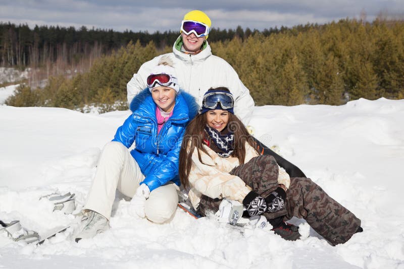 Young People Sitting on the Snow and Smiling Stock Image - Image of ...
