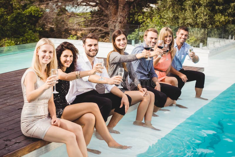 Young People Sitting by Swimming Pool Stock Photo - Image of camera ...