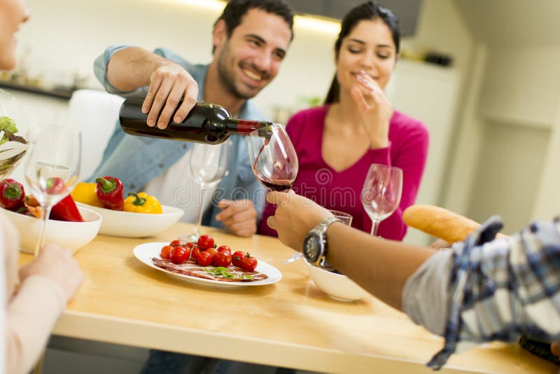 Young People Sitting by the Table Stock Photo - Image of female ...