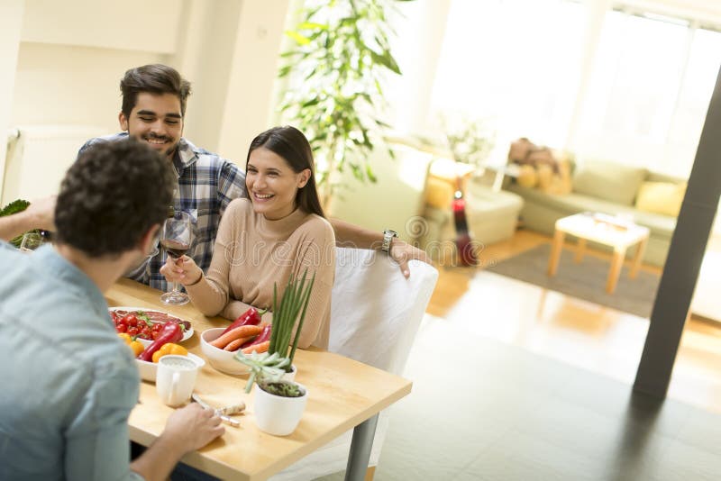 Young People Sitting by the Table Stock Photo - Image of alcohol ...