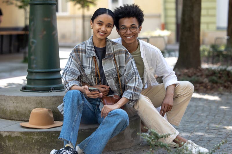 Young People Sitting Together and Looking Happy and Contented Stock ...