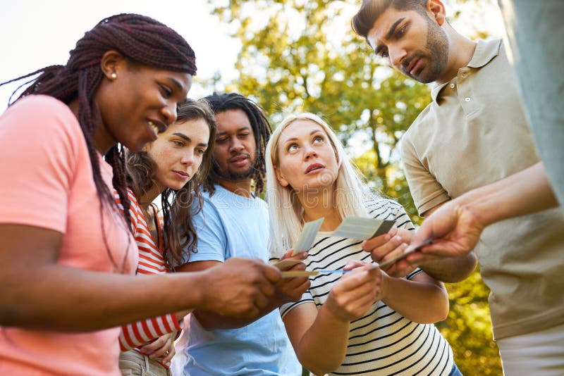Young People Solve a Task Together Outdoors Stock Image - Image of ...
