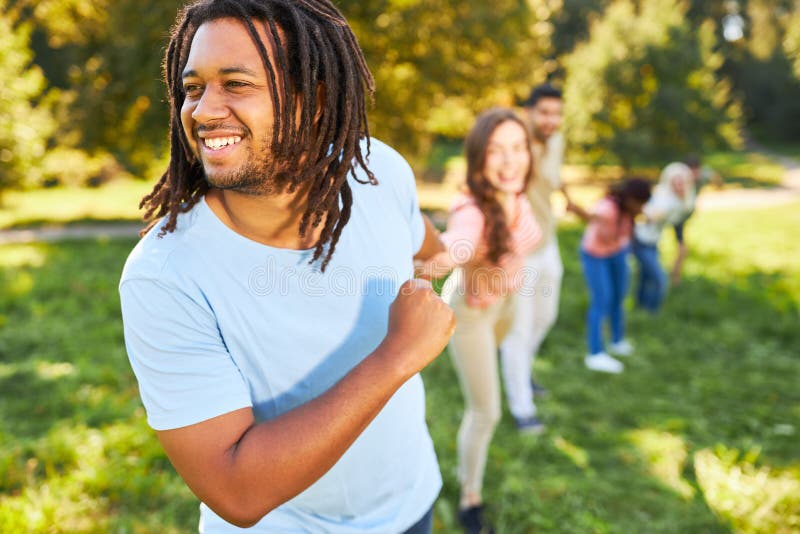 Young People Stand Hand in Hand in Team Building Workshop Stock Photo ...