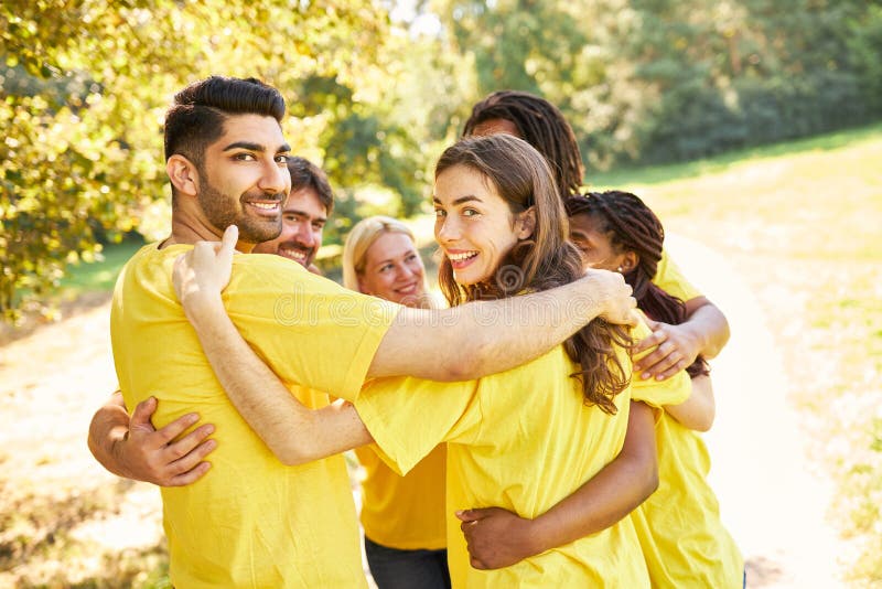 Young People in the Start-up Team Hug Each Other in Summer Stock Photo ...