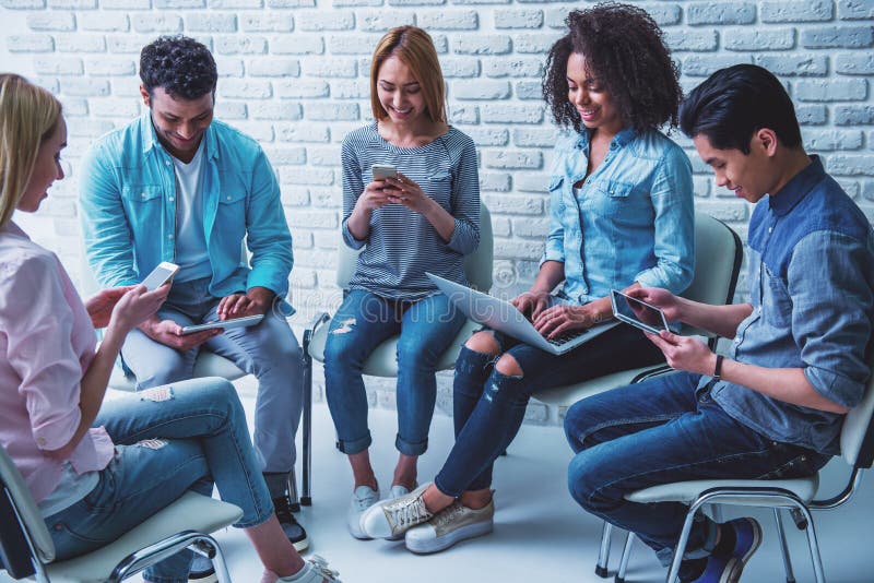 Young people studying stock photo. Image of discussion - 260903240