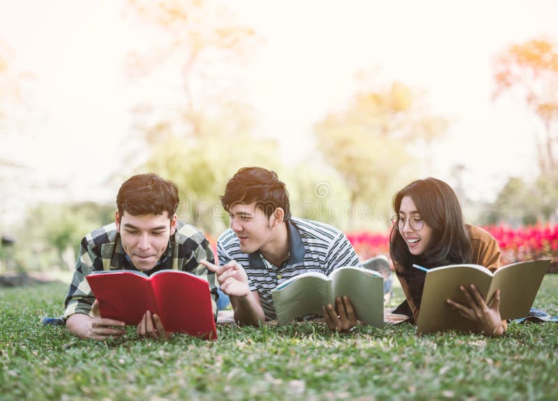 Young People Studying Reading Book in Park. Education Study by Read ...