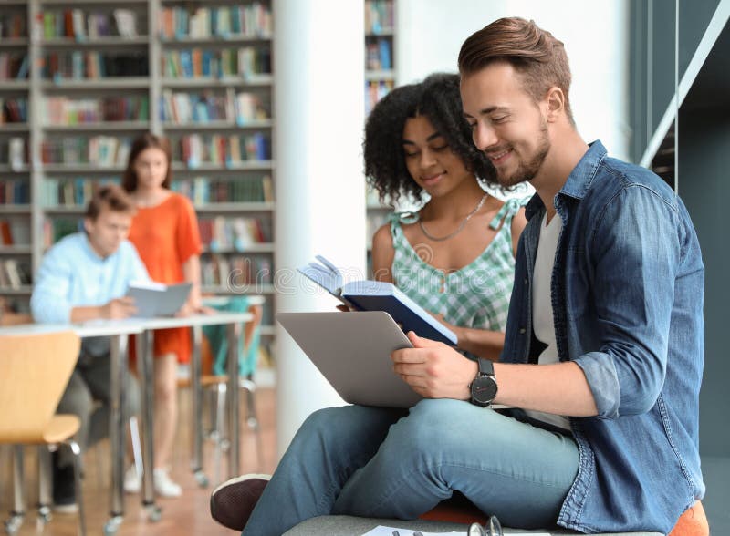 Young People Studying Together in Library Stock Image - Image of girl ...