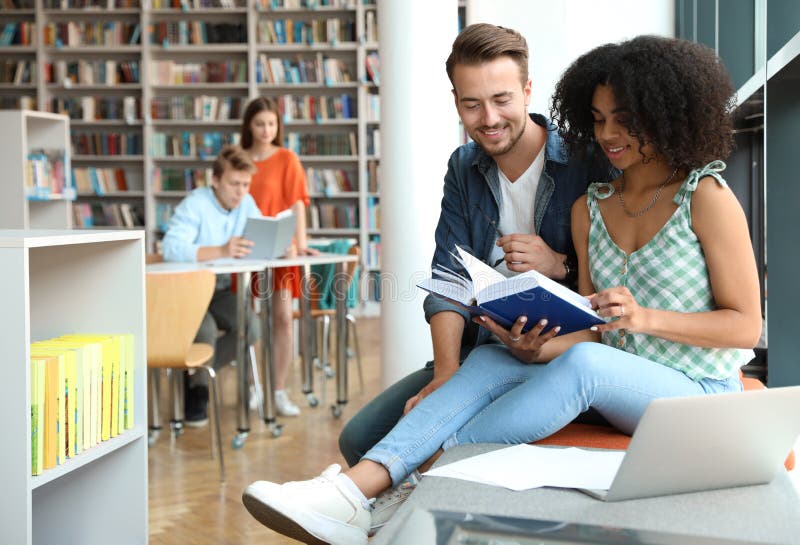 Young People Studying Together in Library Stock Photo - Image of ...