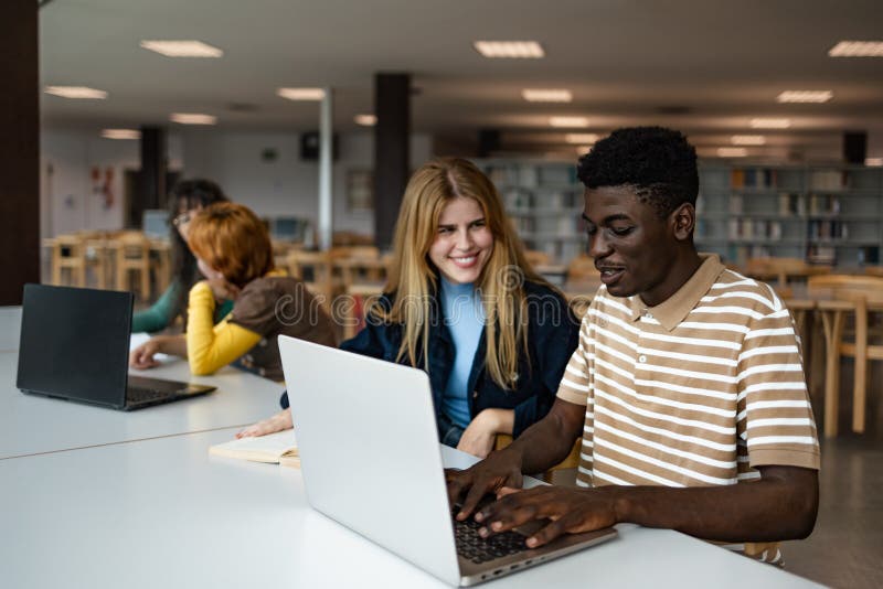 Young People Studying Together in University Library Stock Photo ...