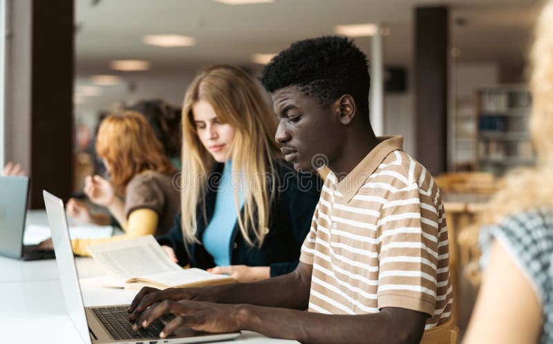 Young People Studying Together in University Library Stock Photo ...
