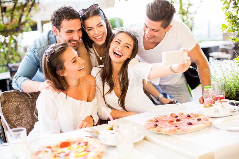 Young people by the table stock image. Image of people - 55361095