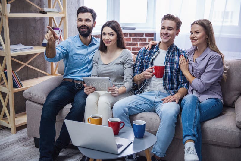 Friends with gadgets stock image. Image of couch, people - 289685839