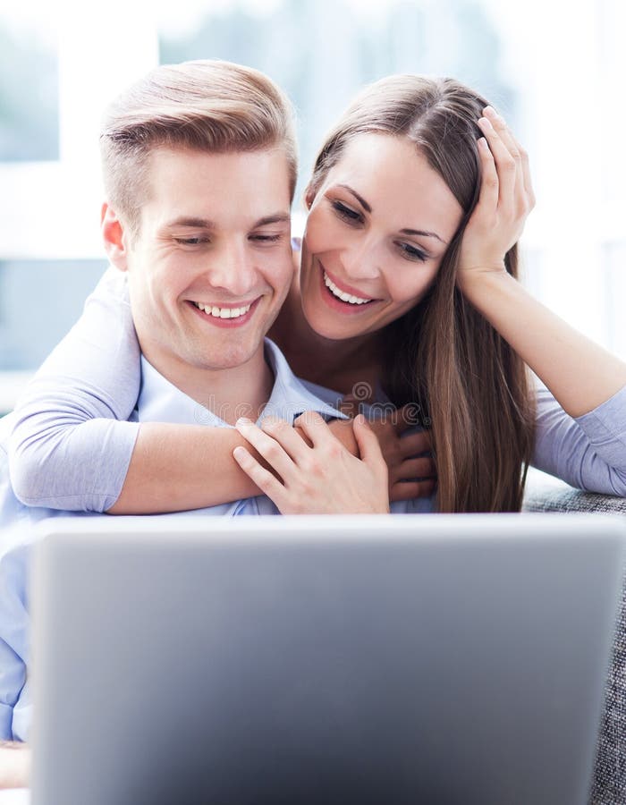 Young people using laptop stock image. Image of attractive - 32023831