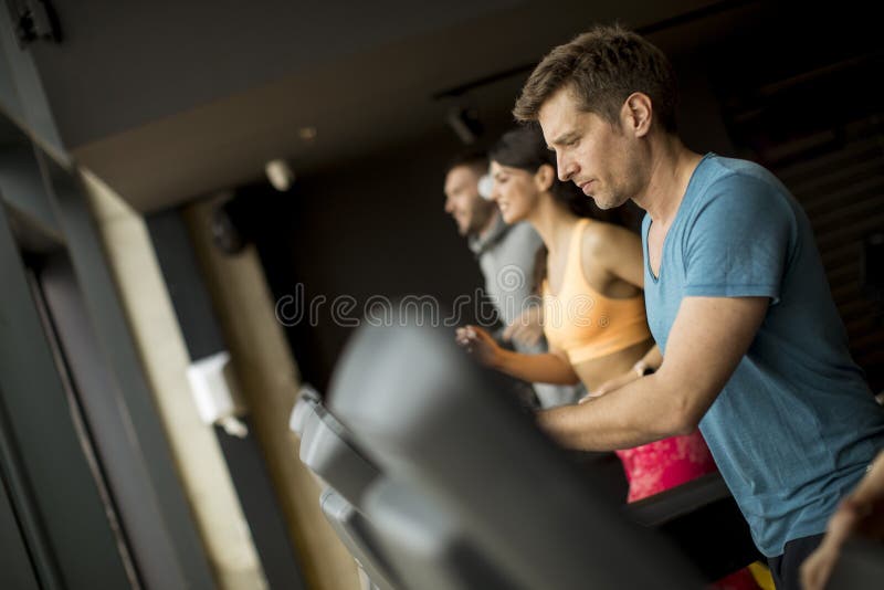 Young People Using Threadmill in Modern Gym Stock Image - Image of ...