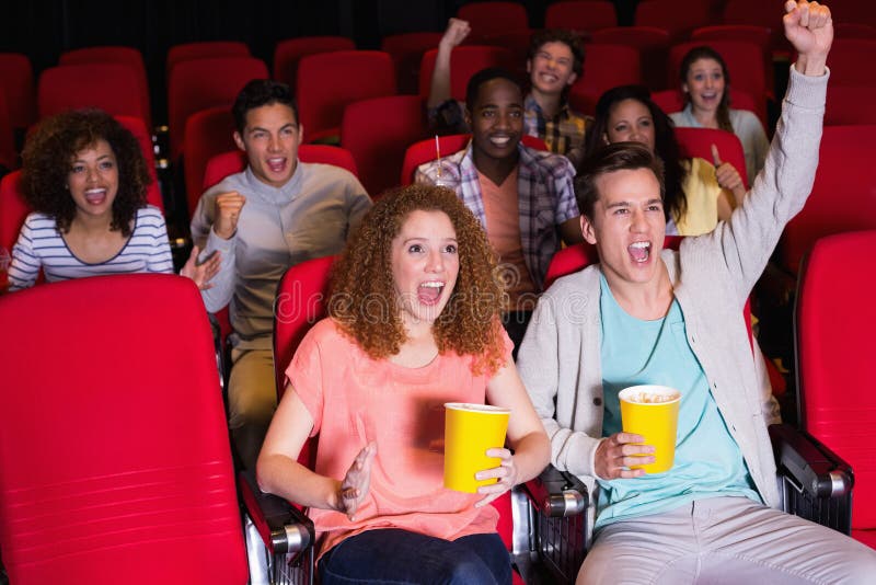 Young People Watching a Film Stock Image - Image of group, cheerful ...