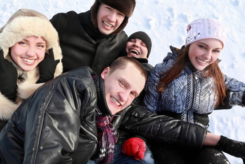 Young People by Winter Day Lie on Snow Stock Image - Image of five ...