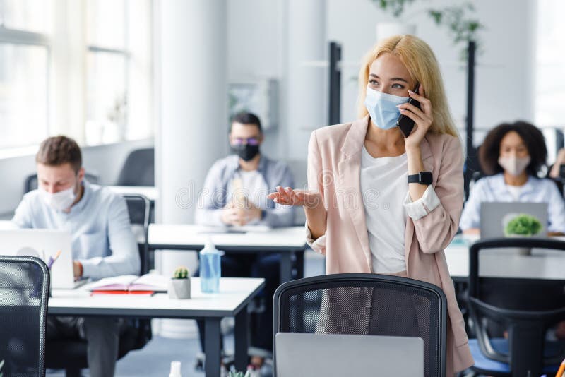Young People Back at Work in Office after Lockdown. Business Woman in ...