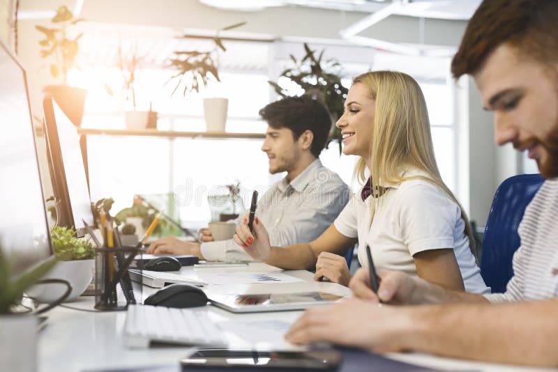 Young People Working on Computers in Office Stock Image - Image of ...
