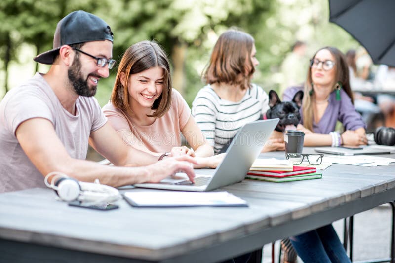 Young People Working at the Outdoor Cafe Stock Image - Image of casual ...