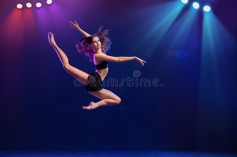 Young Performer of Modern Choreography Dancing in the Spotlights on a ...