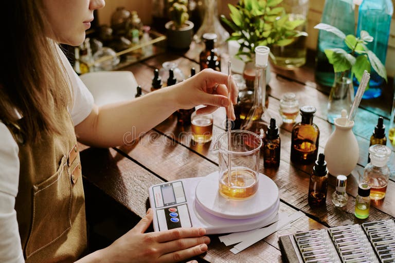 Young Perfumer Blending Essential Oils Stock Photo - Image of liquid ...