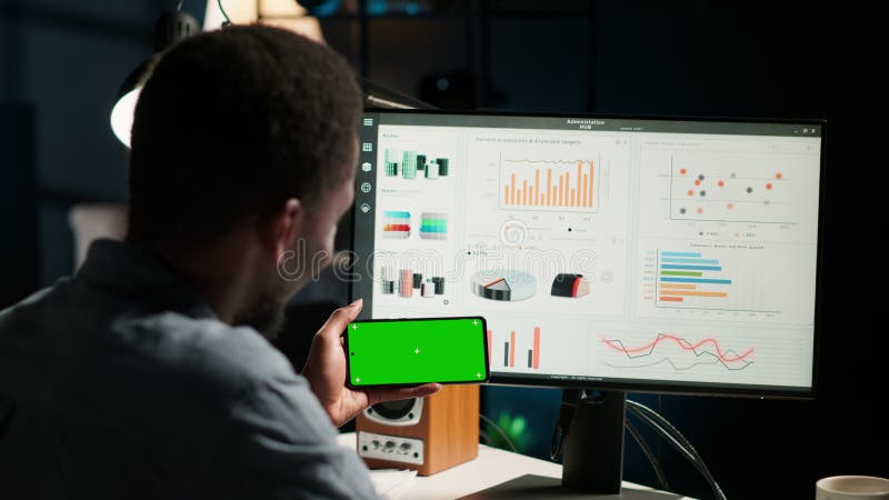 Young Person Does Remote Work Using Data Finances with a Green Screen ...