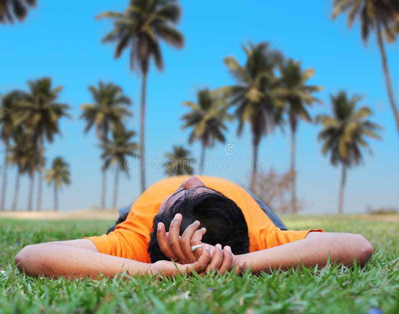 Young Person Relaxing In A Garden On Lawn Stock Photos - Image: 23722853