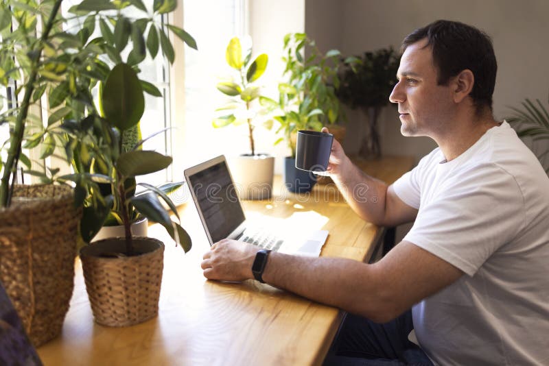 Young Personal Development Coach Answering the Client by Email by a ...